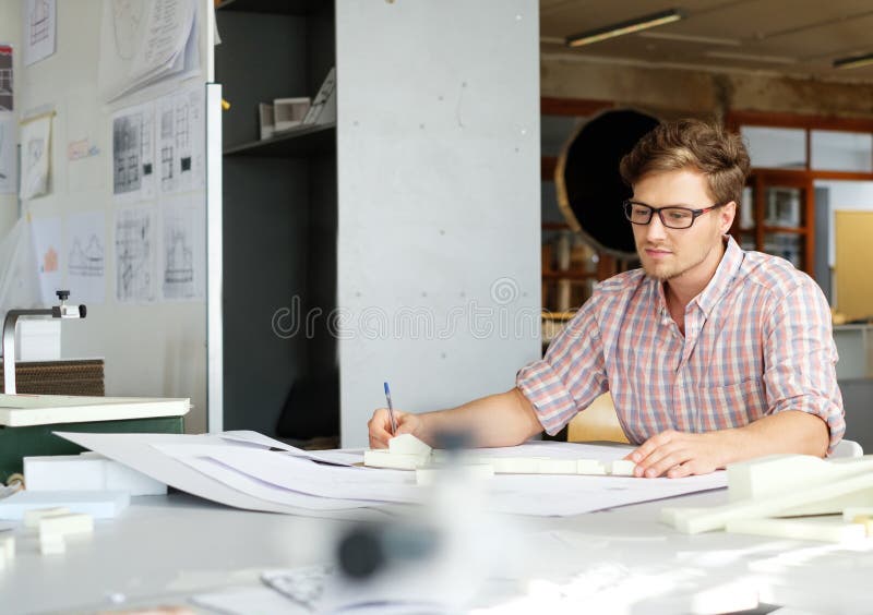 Young Architect Working on Drawing Table in Architect Studio. Stock ...