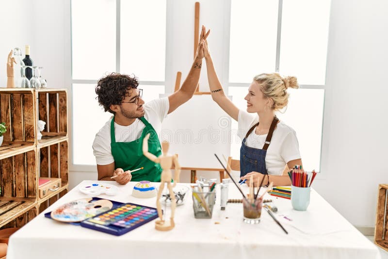Young Artist Couple Smiling Happy High Five at Art Studio Stock Image ...