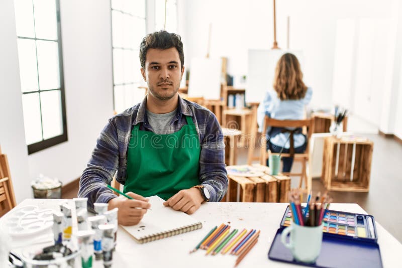 Young Artist Man at Art Studio Relaxed with Serious Expression on Face ...
