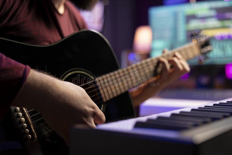 Young Artist Playing Guitar Creating Music Using Daw Software Interface ...