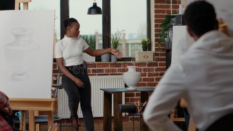 Young Artist Pointing at Vase Model on Table To Teach Drawing Practice ...