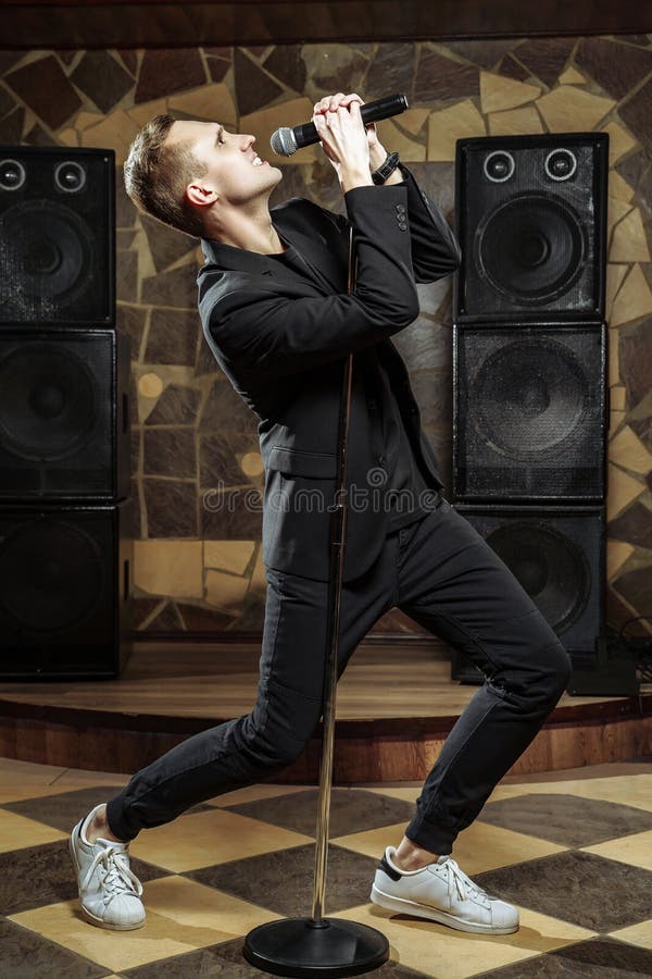 Young Artistic Man Singing with Microphone Stock Image - Image of ...