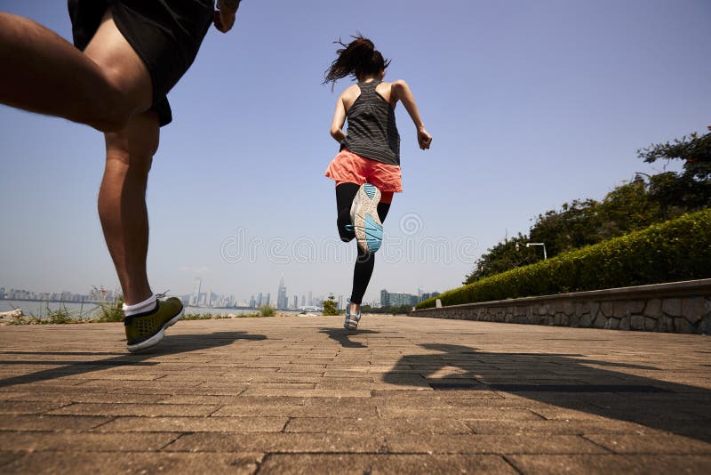 Young Asian Adults Running Outdoors Stock Photo - Image of adult ...
