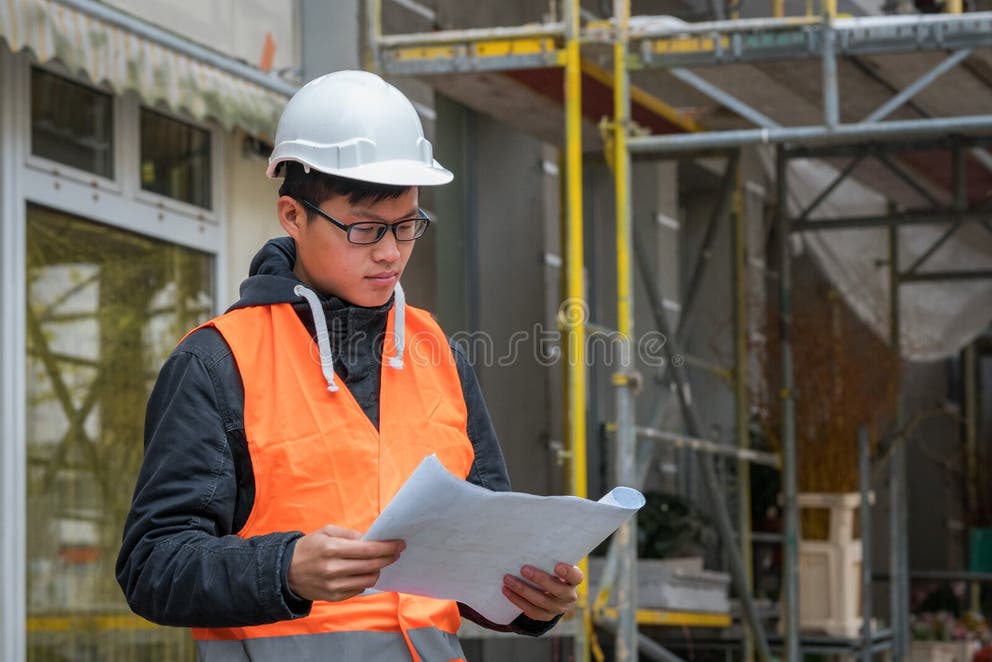 Young Asian Engineer at Work on Construction Site Stock Photo - Image ...