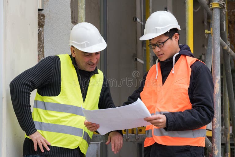 Young Asian Apprentice at Work with Senior Engineer Stock Photo - Image ...