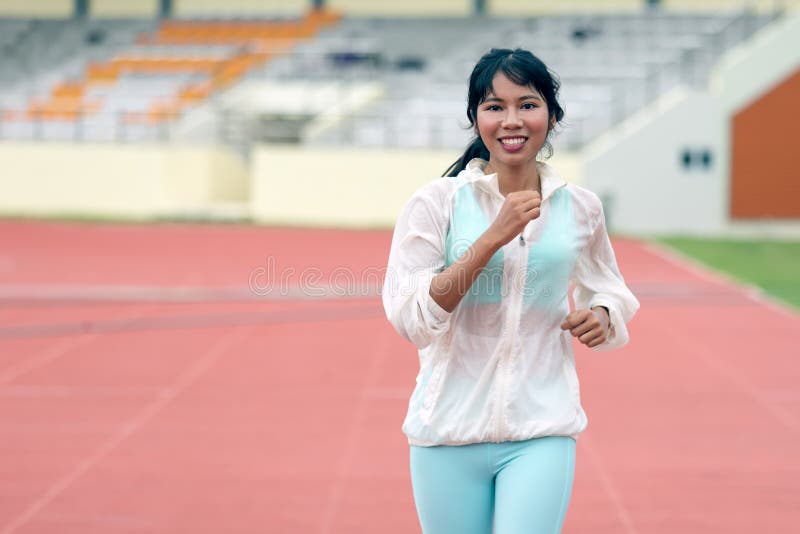 Young Asian Athletic Woman Practice Running in Track Stock Photo ...