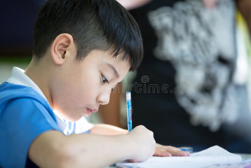 Young Asian Boy Doing His Homework Stock Image - Image of adorable ...