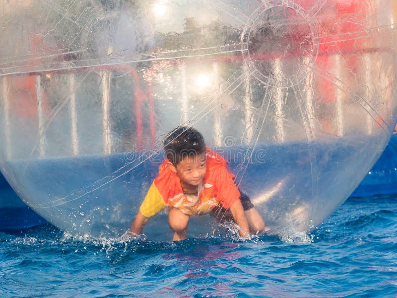 Boy in floating ball stock photo. Image of globe, walk - 5853434