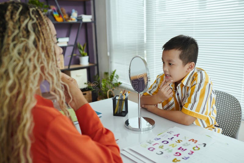 Engaging in Child Therapy Session with Mirror Interaction Stock Image ...