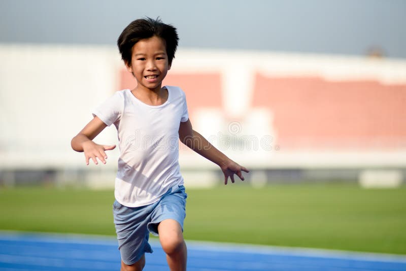 Young Boy Running on Blue Track Stock Photo - Image of asian, kids ...