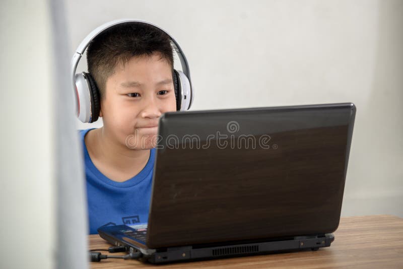 Young Asian Boy Using Laptop Technology Stock Photo - Image of house ...