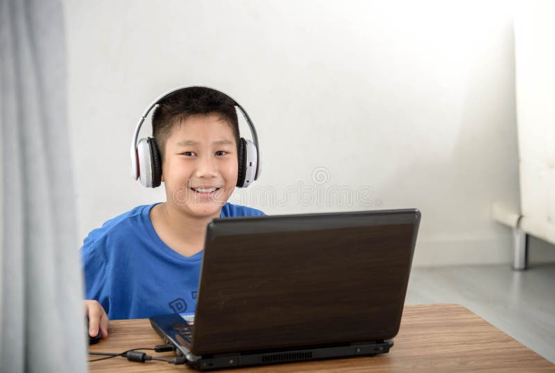 Young Asian Boy Using Laptop Technology at Home. Copyspace Stock Image ...