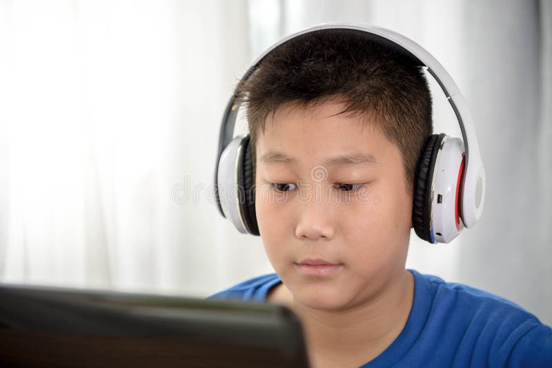 Young Asian Boy Using Laptop Technology at Home. Copyspace Stock Image ...