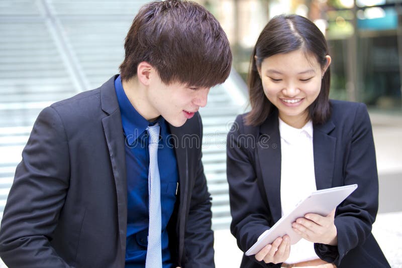 Young Asian Business Executives Discussing Using Tablet PC Stock Image ...