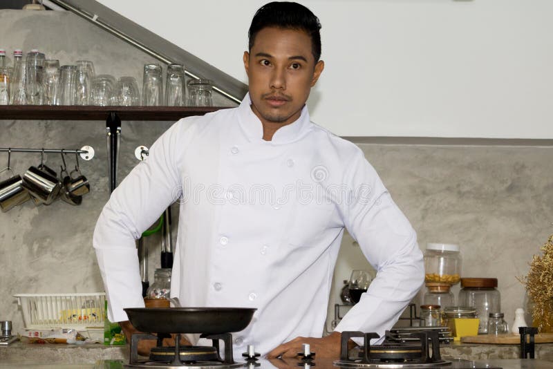 Young Asian Chef is Cooking in the Kitchen Stock Image - Image of ...