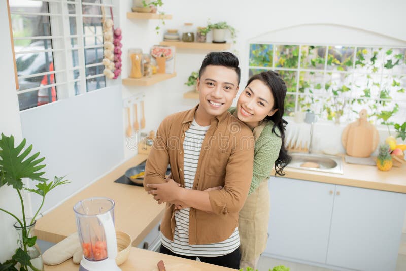 Young Asian Couple Cooking in Kitchen Stock Image - Image of cheerful ...