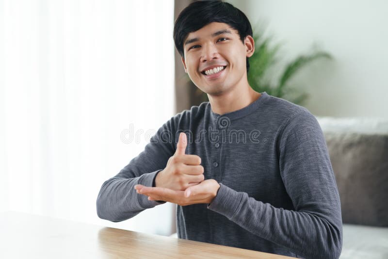 Young Asian Man Using Smartphone for Online Video Conference Call ...