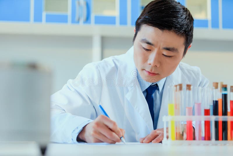 Young Asian Doctor in Uniform Working at Testing Laboratory Stock Image ...
