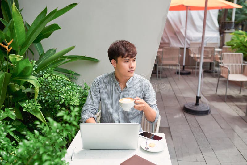 Young Asian Economist Using Laptop in Coffee Shop Stock Photo - Image ...