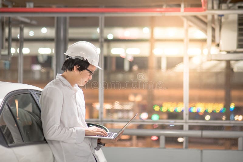 Young Asian Engineer or Architect Working with Laptop Stock Image ...