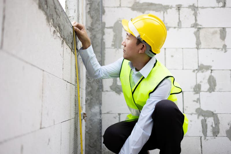 Young Asian Engineer in Engineering Uniform and Helmet at Construction ...
