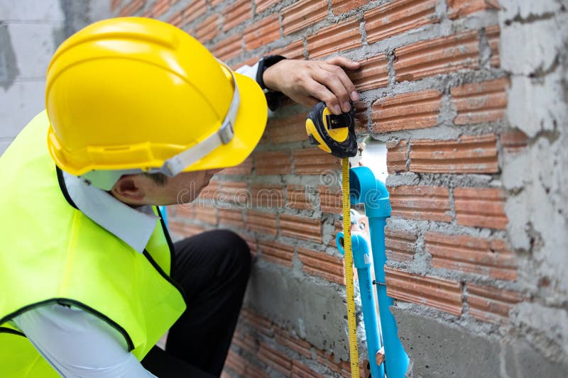 Young Asian Engineer in Engineering Uniform and Helmet at Construction ...