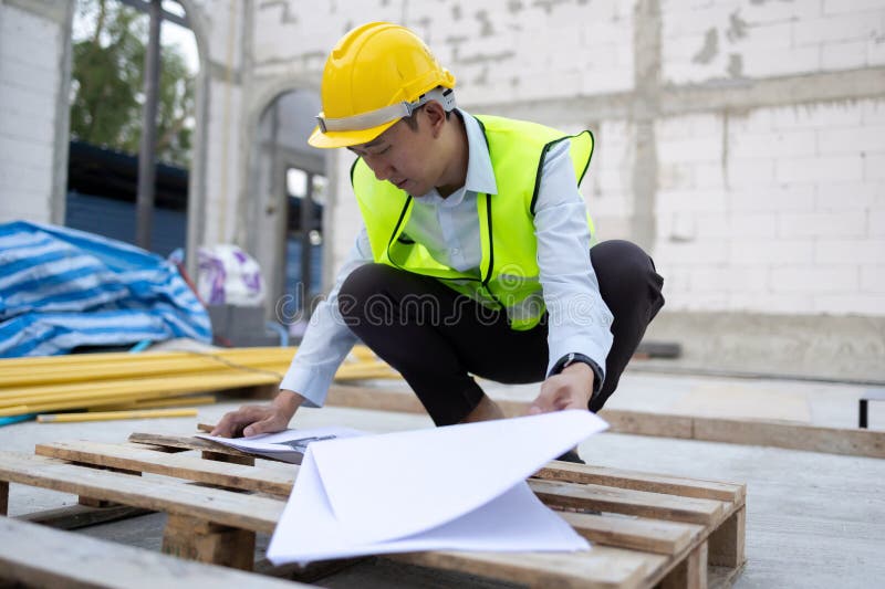 Young Asian Engineer in Engineering Uniform and Helmet at Construction ...