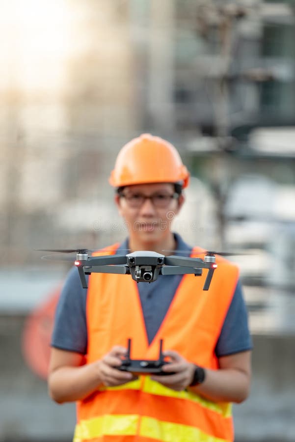 Young Asian Engineer Flying Drone Over Construction Site Stock Image ...