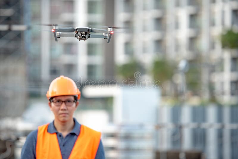 Young Asian Engineer Flying Drone Over Construction Site Stock Image ...