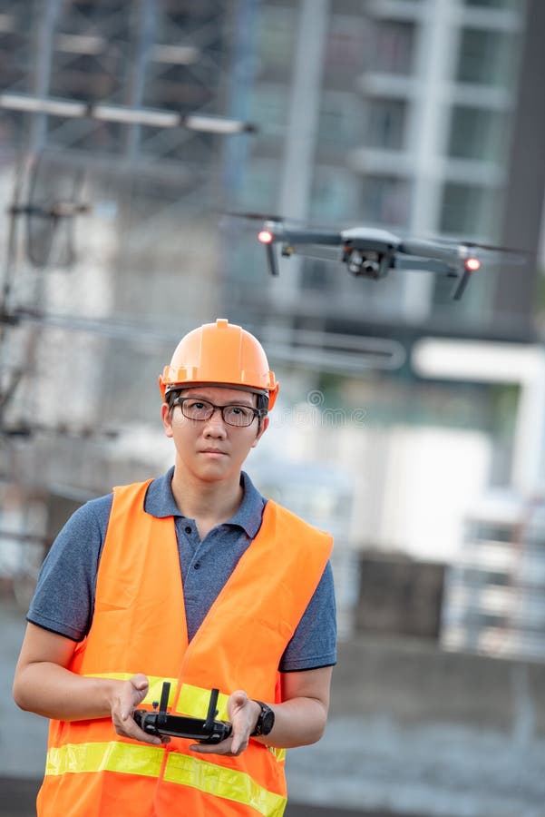 Young Asian Engineer Man Flying Drone Over Construction Site Stock ...