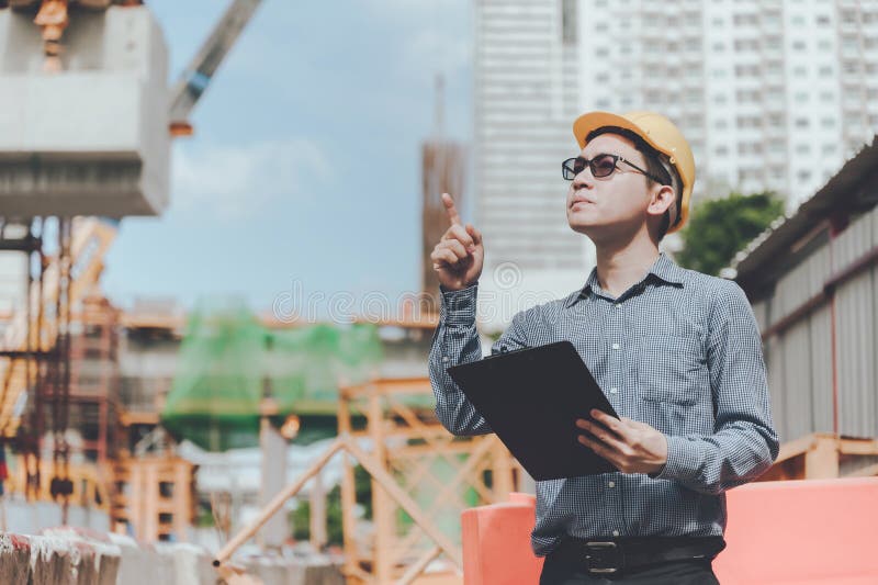 Young Asian Engineers are Working on the Construction Site Stock Image ...