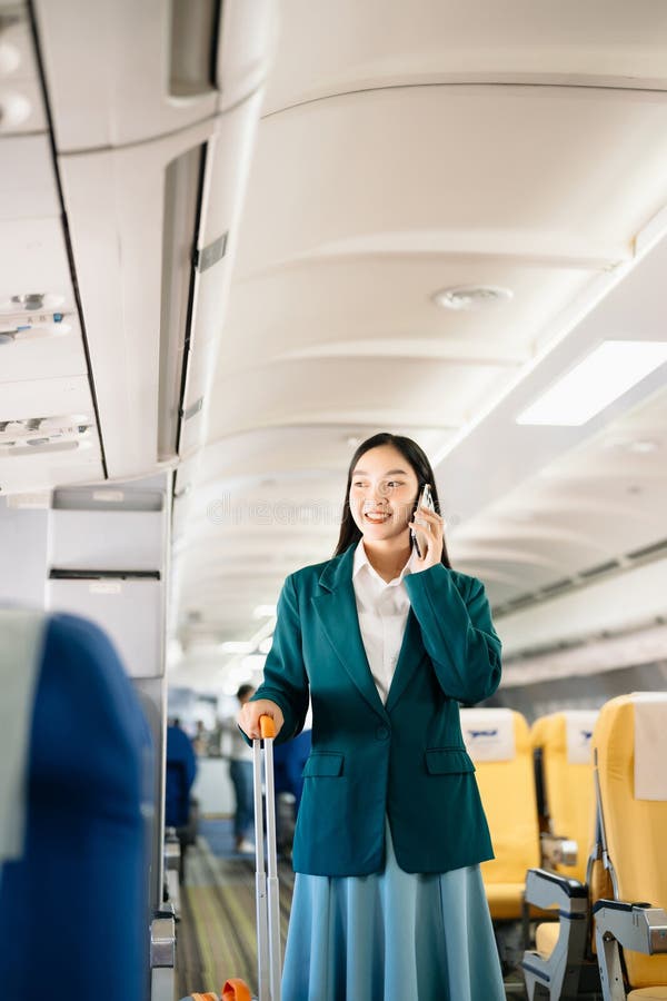 Young Asian Executive Excels in First Class, Multitasking with Digital ...