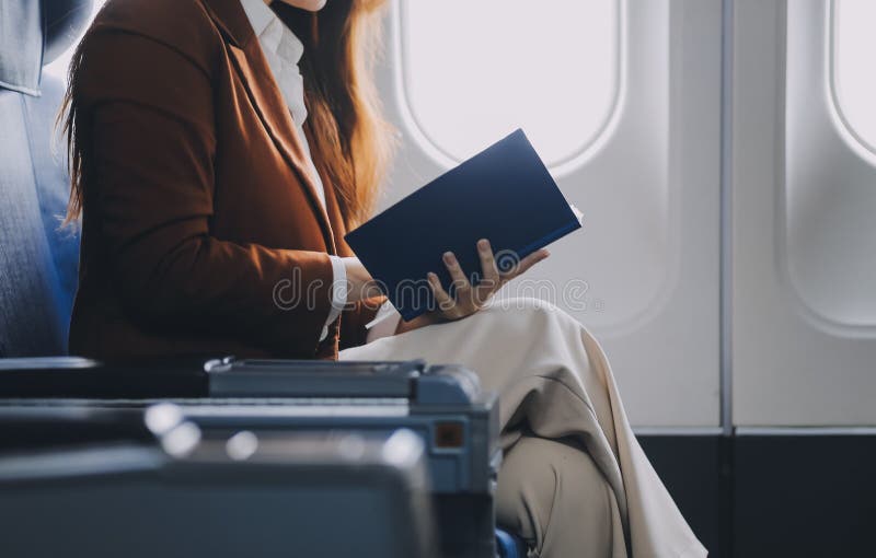 Young Asian Executive Excels in First Class, Multitasking with Digital ...