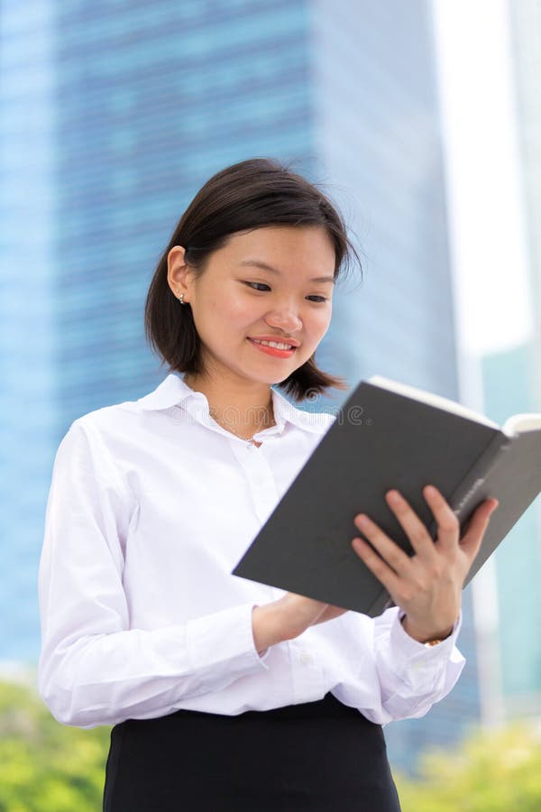 Young Asian Female Executive Reading Book Stock Image - Image of ...