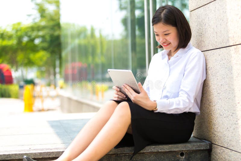 Young Asian Female Executive Using Tablet PC Stock Photo - Image of ...