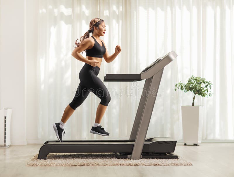 Young Asian Female Running on a Treadmill Stock Photo - Image of spin ...
