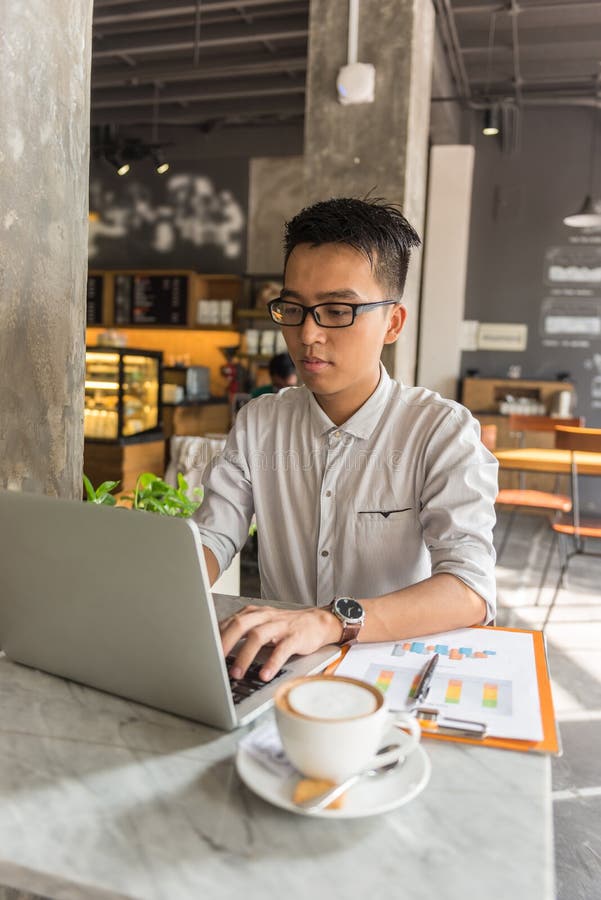 Young Asian Freelancer Working on Laptop at Cafe Stock Image - Image of ...