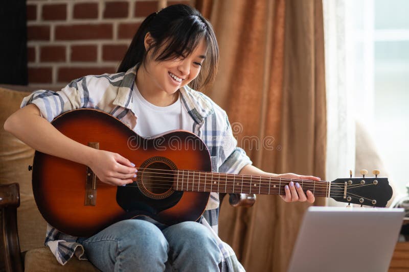 Young Asian Girl Playing the Guitar at Home Stock Photo - Image of play ...