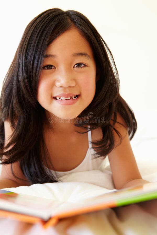 Young Asian Girl Reading Book Stock Image - Image of learning ...