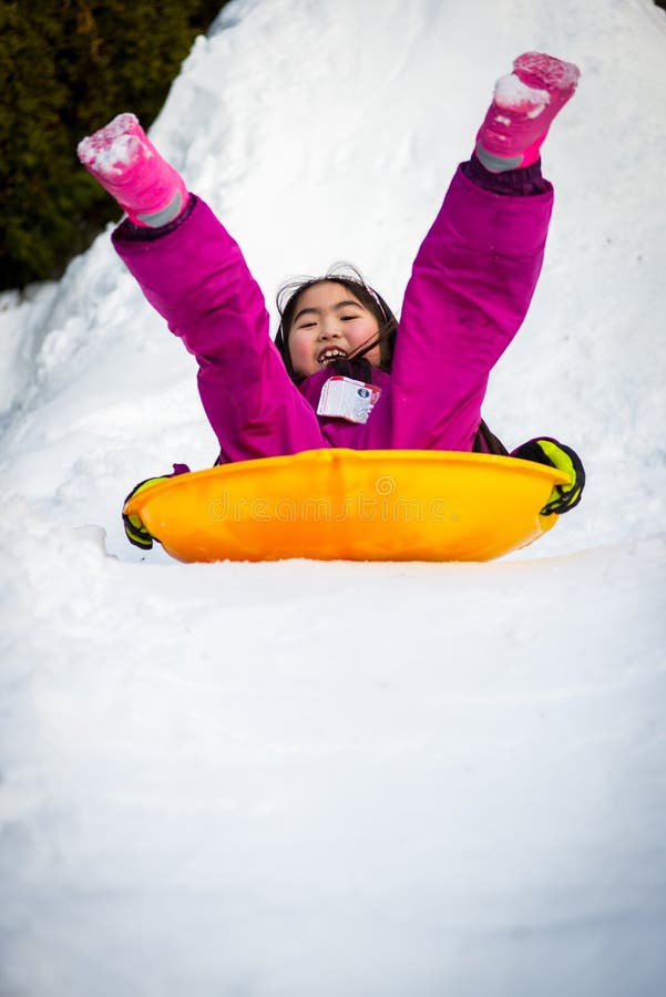 Young Asian Girl Sledding after Snow Stock Photo - Image of child, sled ...