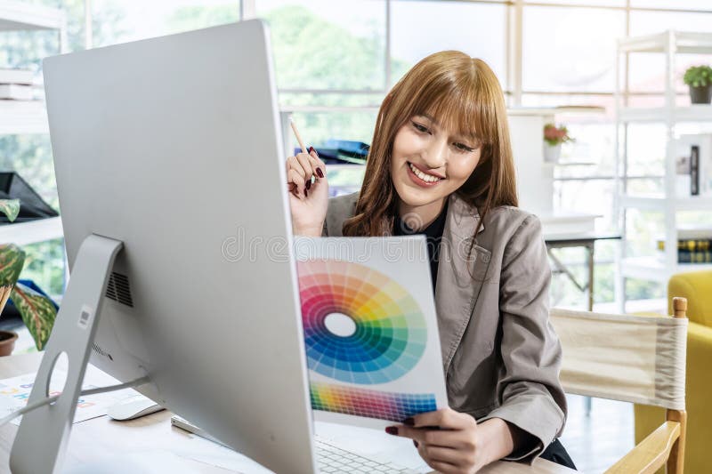 Young Asian Graphic Designer Woman Working in a Creative Dynamic Office ...