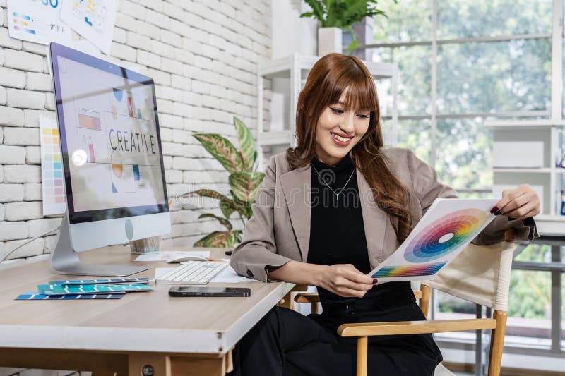 Young Asian Graphic Designer Woman Working in a Creative Dynamic Office ...