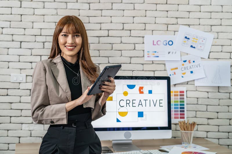 Young Asian Graphic Designer Woman Working in a Creative Dynamic Office ...