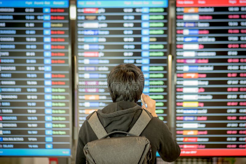 Young Asian Man with Backpack Bag Checking His Flight Stock Photo ...