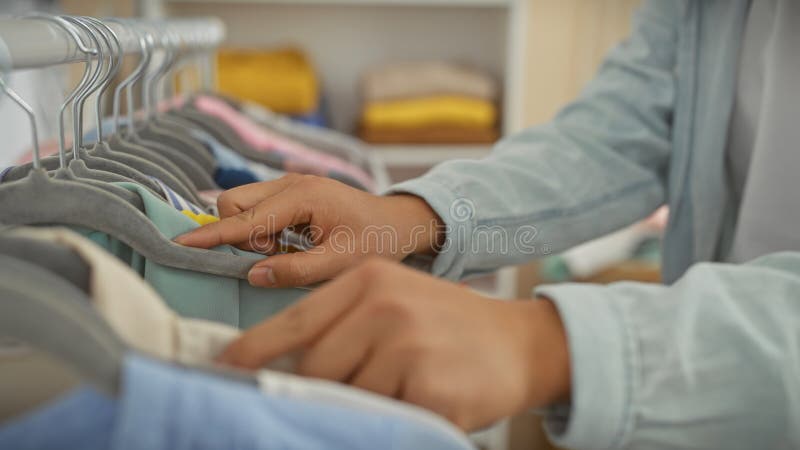 A Young Asian Man Browsing Clothes in a Modern Wardrobe Indoors Stock ...