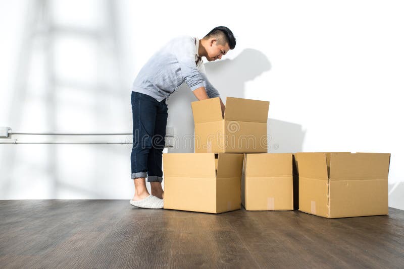 Young Asian Man Moving House Packing Cardboard Using Adhesive Stock ...