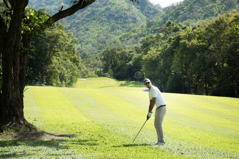 Asian Man Playing Golf on a Beautiful Natural Golf Course Stock Image ...