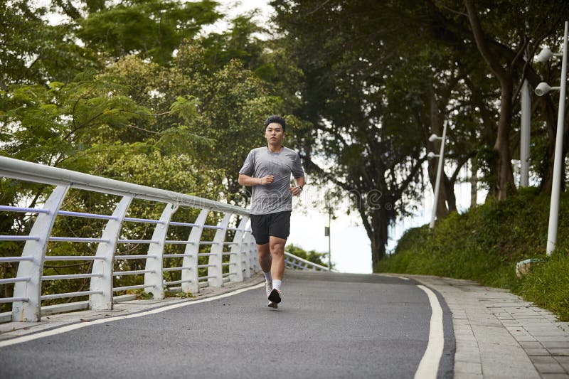 Young Asian Man Running Jogging Outdoors Stock Photo - Image of athlete ...