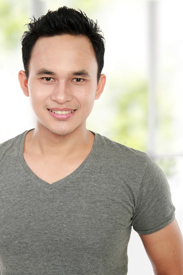 Young asian man smiling stock image. Image of stand, alone - 23797775