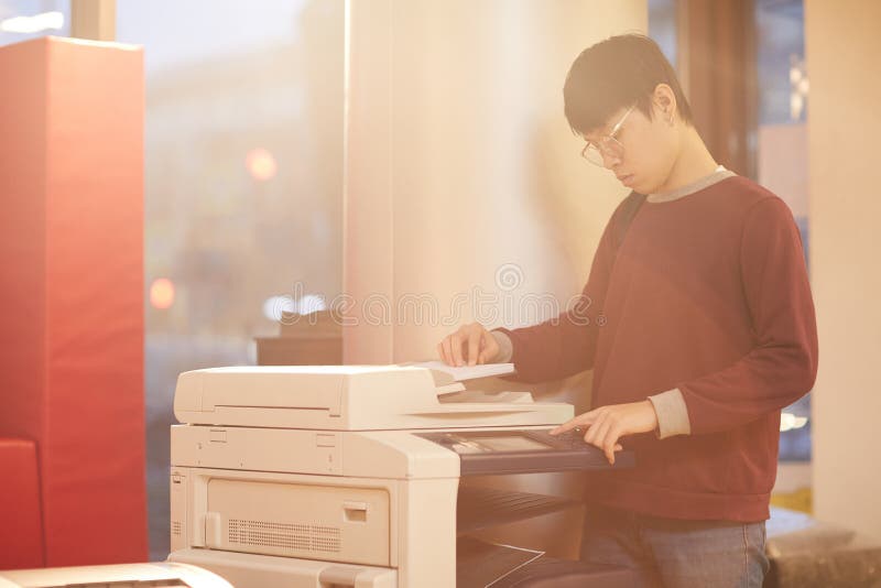Man using copy machine stock image. Image of working - 170319849